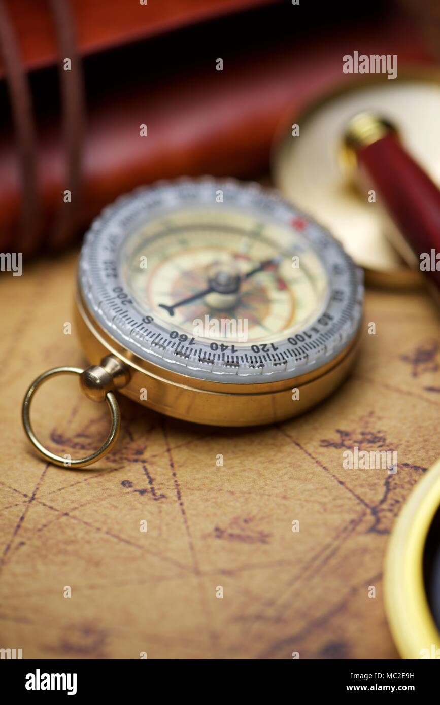 Vintage compass and old navigation map Stock Photo - Alamy