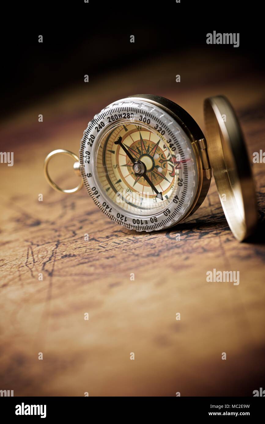 Vintage compass and old navigation map Stock Photo - Alamy