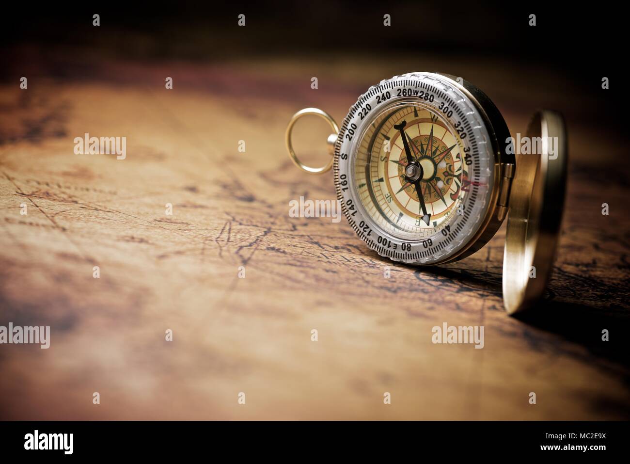 Vintage compass and old navigation map Stock Photo - Alamy