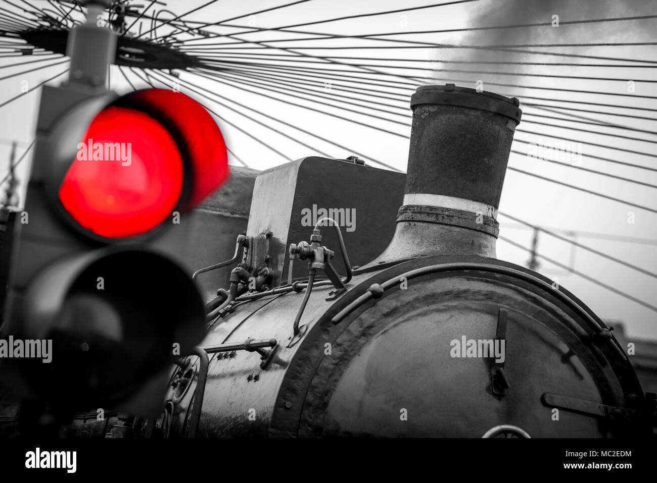 old train with red traffic light - black and white image Stock Photo ...