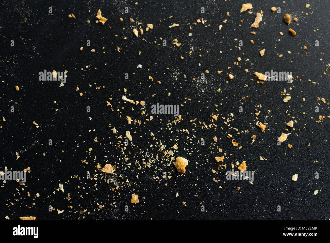 Top view of bread crumbs on dark background Stock Photo - Alamy
