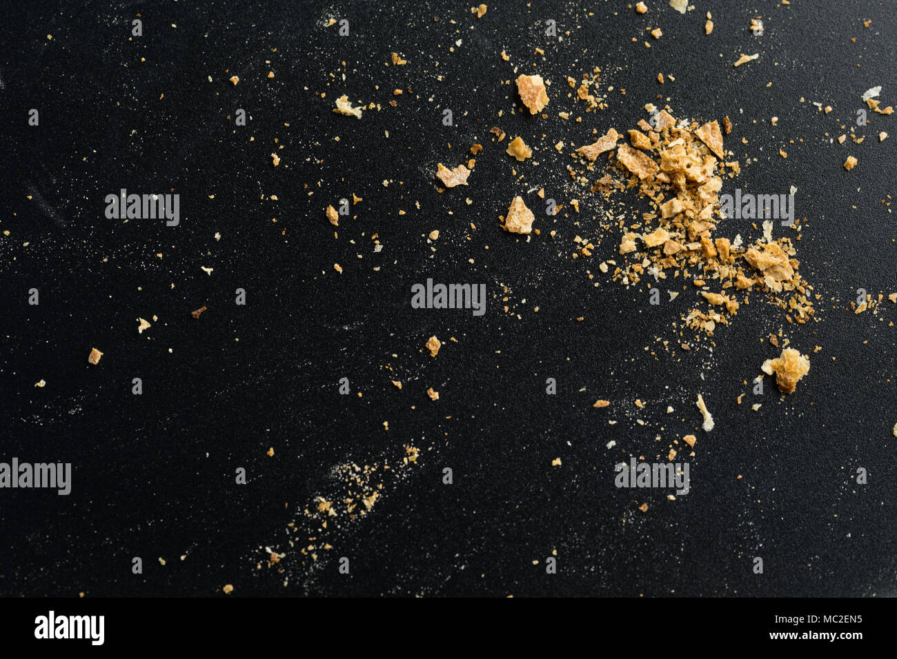Top view of bread crumbs on dark background Stock Photo - Alamy