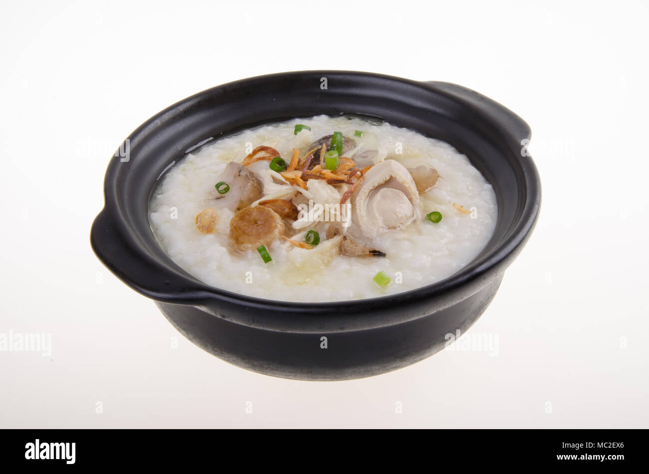 Porridge, abalone & chicken Porridge (congee) served in claypot Stock ...