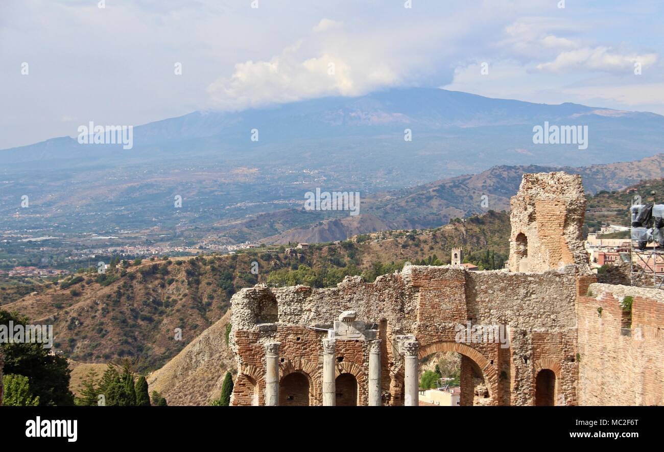 a view from the Ancient Greek theatre of Taormina overlooking Mount ...