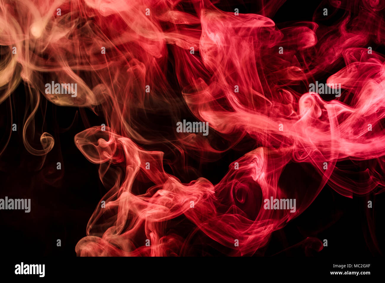 Thick red colorful smoke on a black isolated background. Background ...