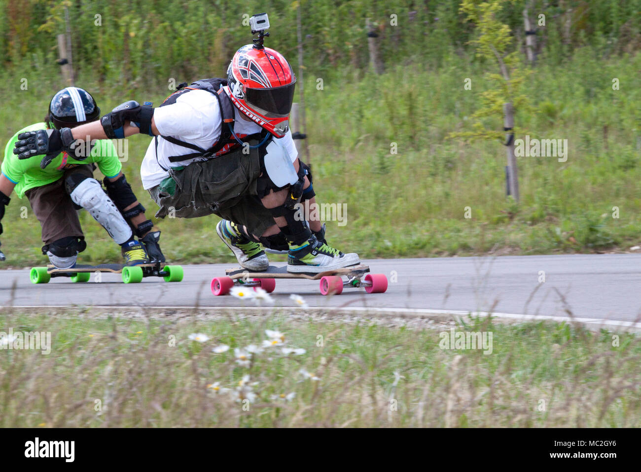 Longboarding, downhill racing on skateboards Stock Photo - Alamy