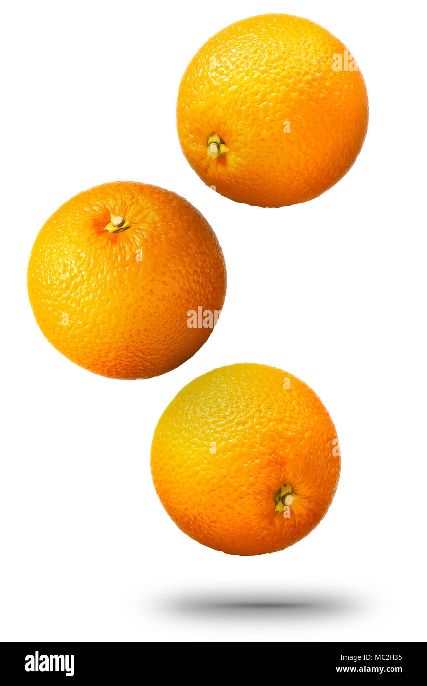 Falling oranges fruit isolated on white background Stock Photo - Alamy