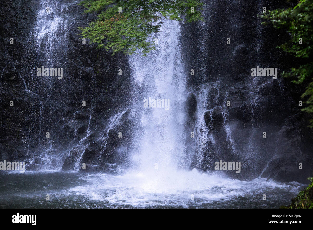Water splashes into a pool at the Mino Waterfall in northern Osaka ...