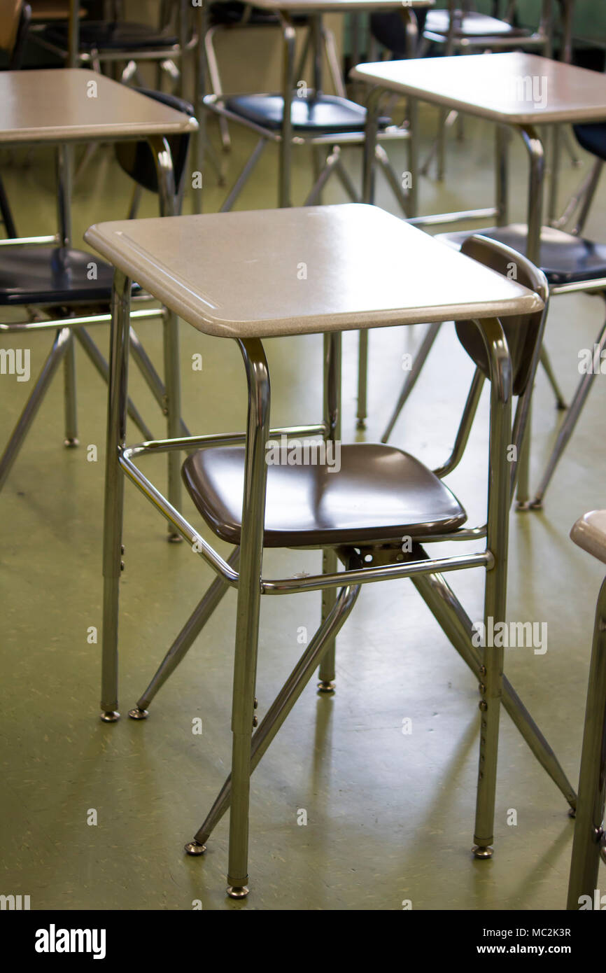 Desks in a classroom Stock Photo - Alamy
