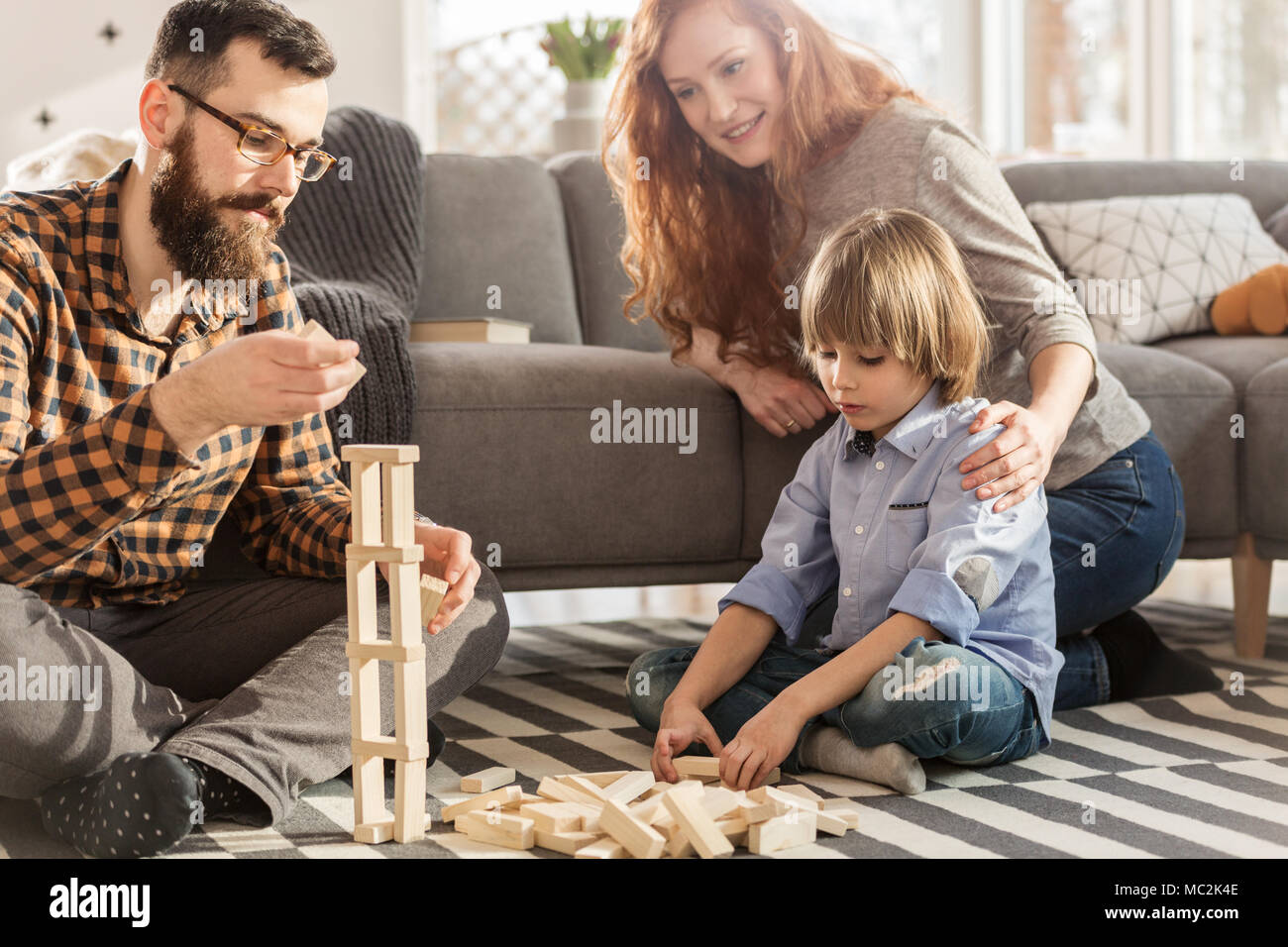 Young family building blocks hi-res stock photography and images - Alamy