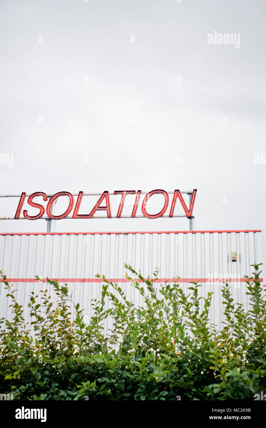 Isolation - a sign in red letters on a warehouse building Stock Photo ...