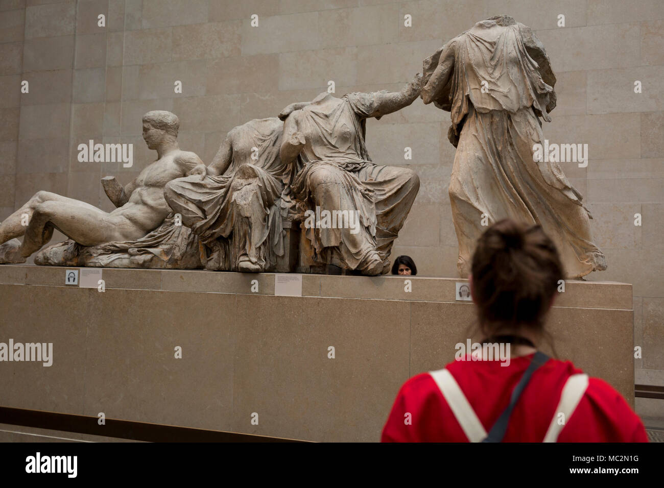 Visitors admire the sculpture of the ancient Greek Parthenon's (Elgin) Marbles Metopes in the ...