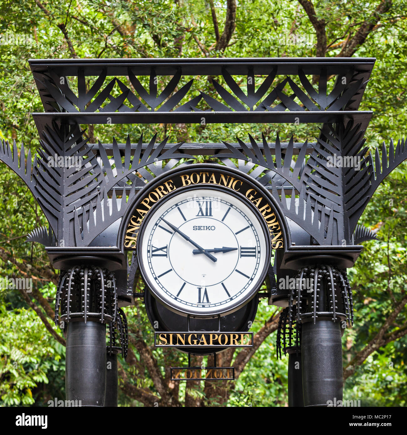 SINGAPORE - OCTOBER 17, 2014: Old Clock in The Singapore Botanic ...