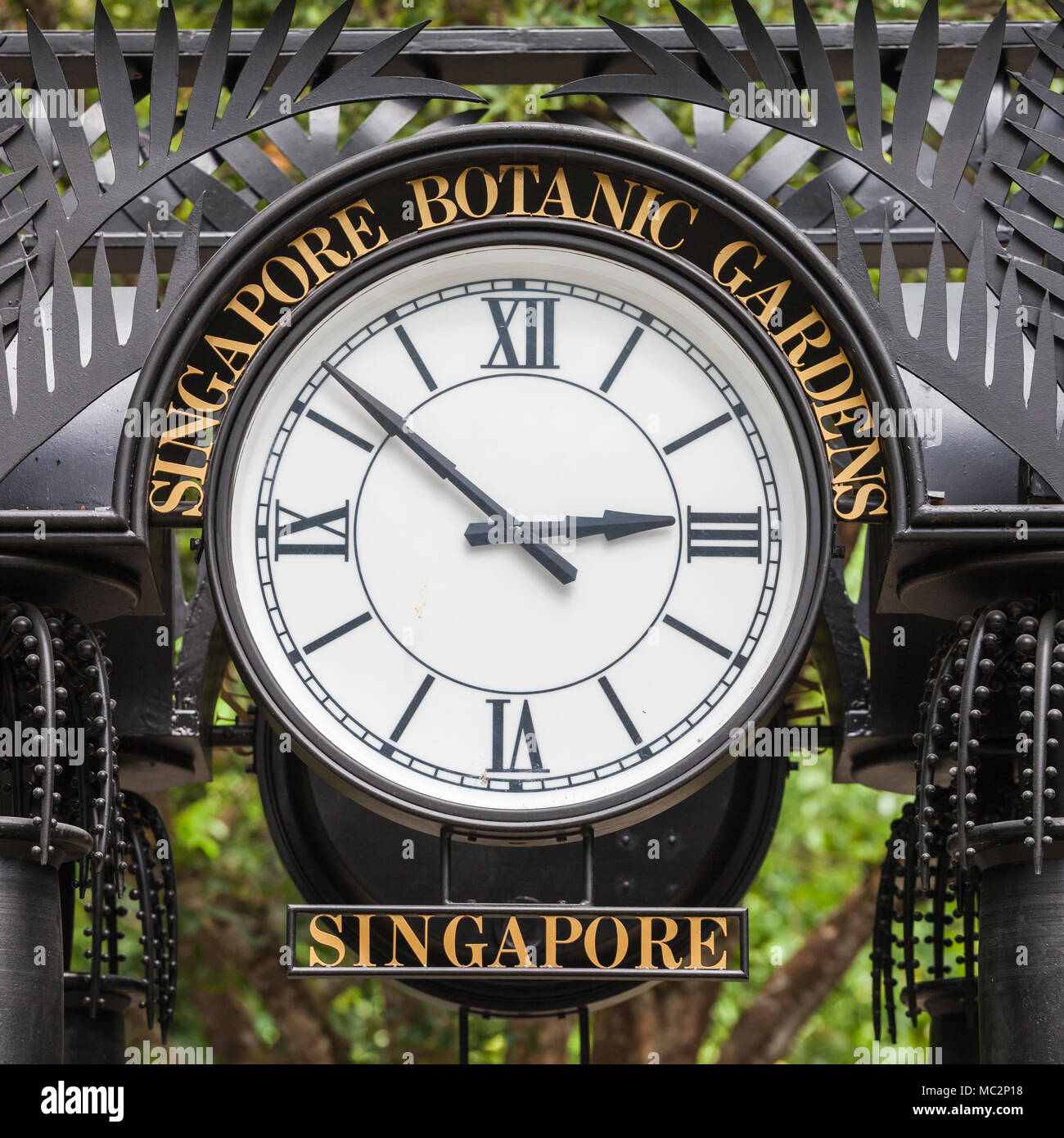 SINGAPORE - OCTOBER 17, 2014: Old Clock in The Singapore Botanic ...