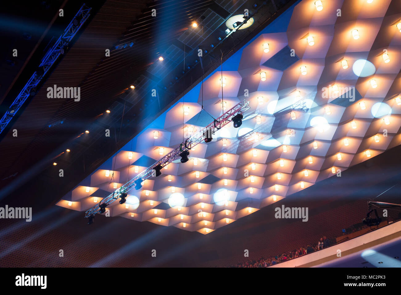 chandeliers and stage lights under the ceiling of the concert hall ...