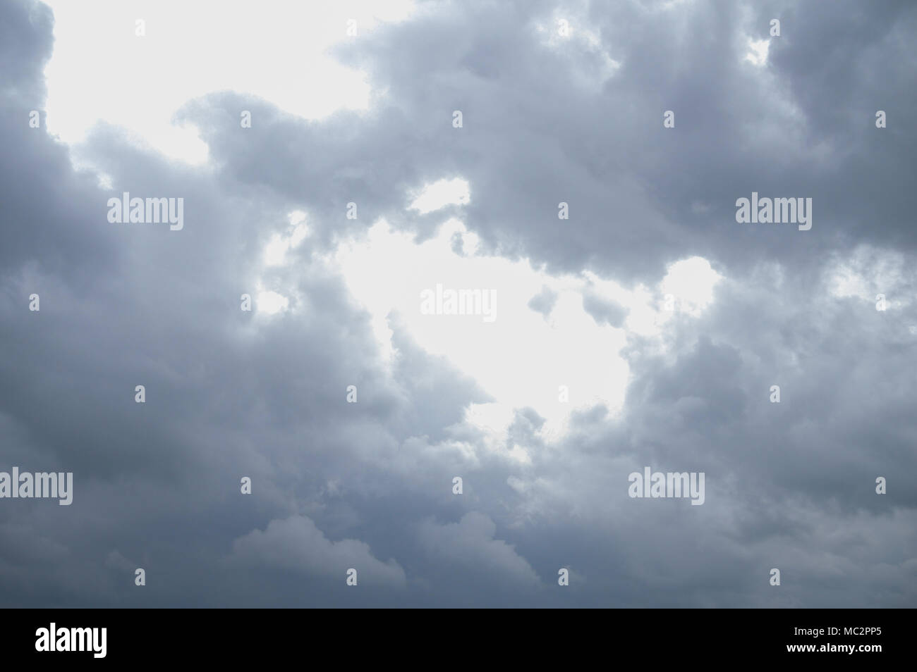 Light Behind Dark Clouds Stock Photo - Alamy