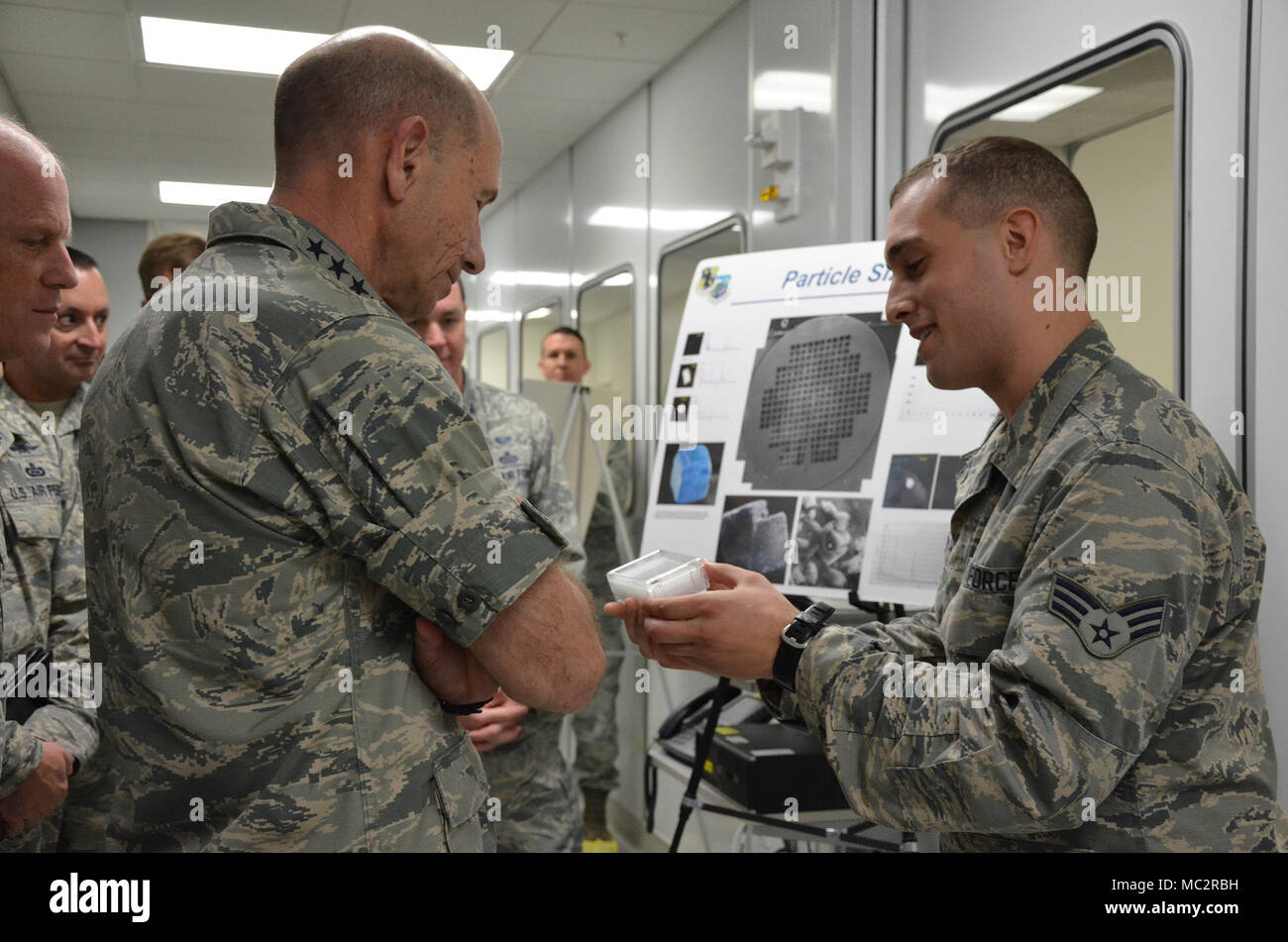 Senior Airman Dylan B. Melone (right), a clean room technician with the ...