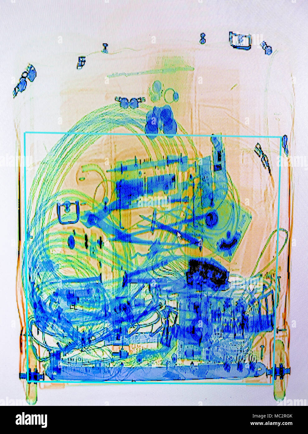 X-ray screenshot of an trolley bag full of cable and electronics Stock ...