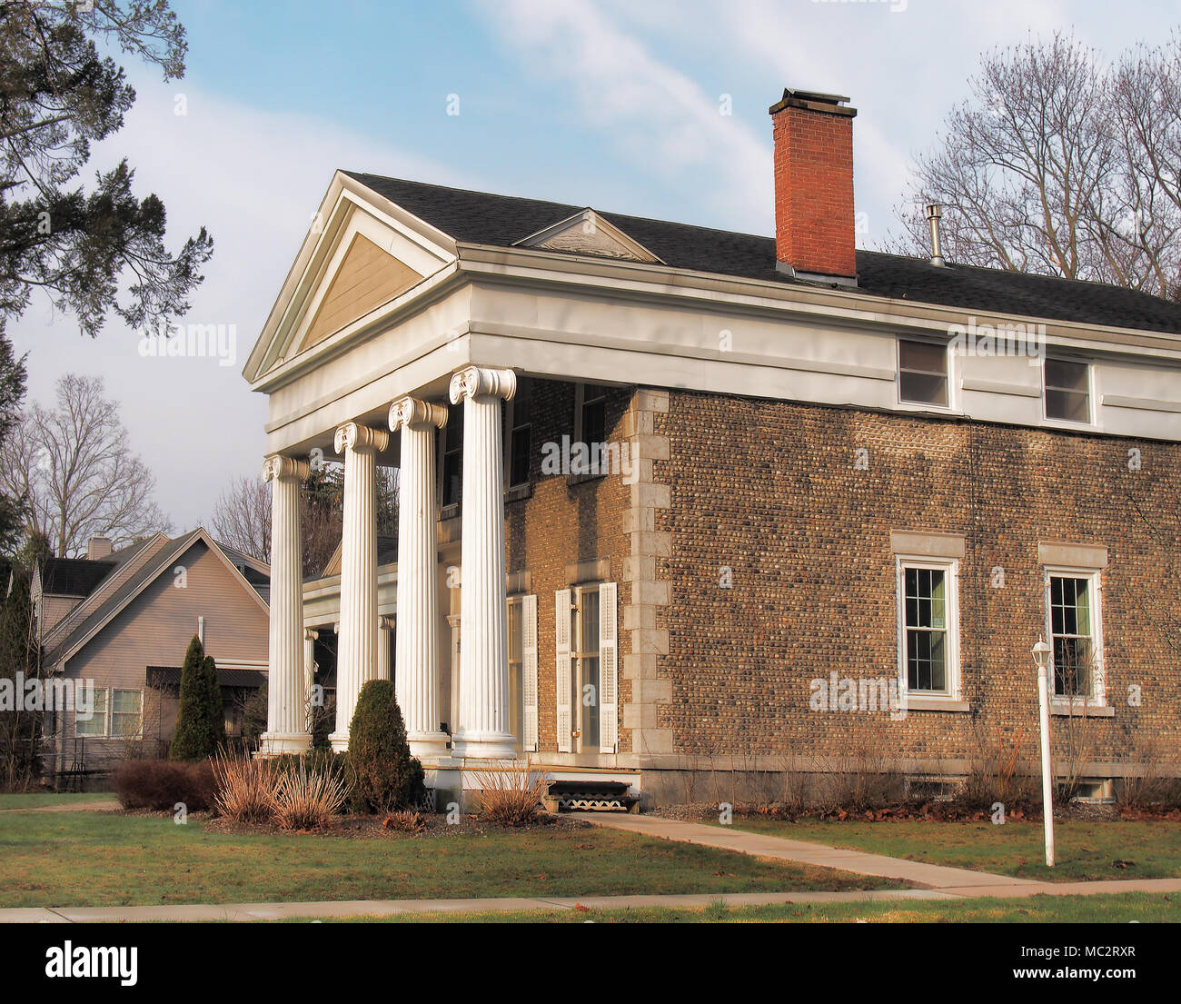 Beautiful home with pillars in a small village Stock Photo - Alamy