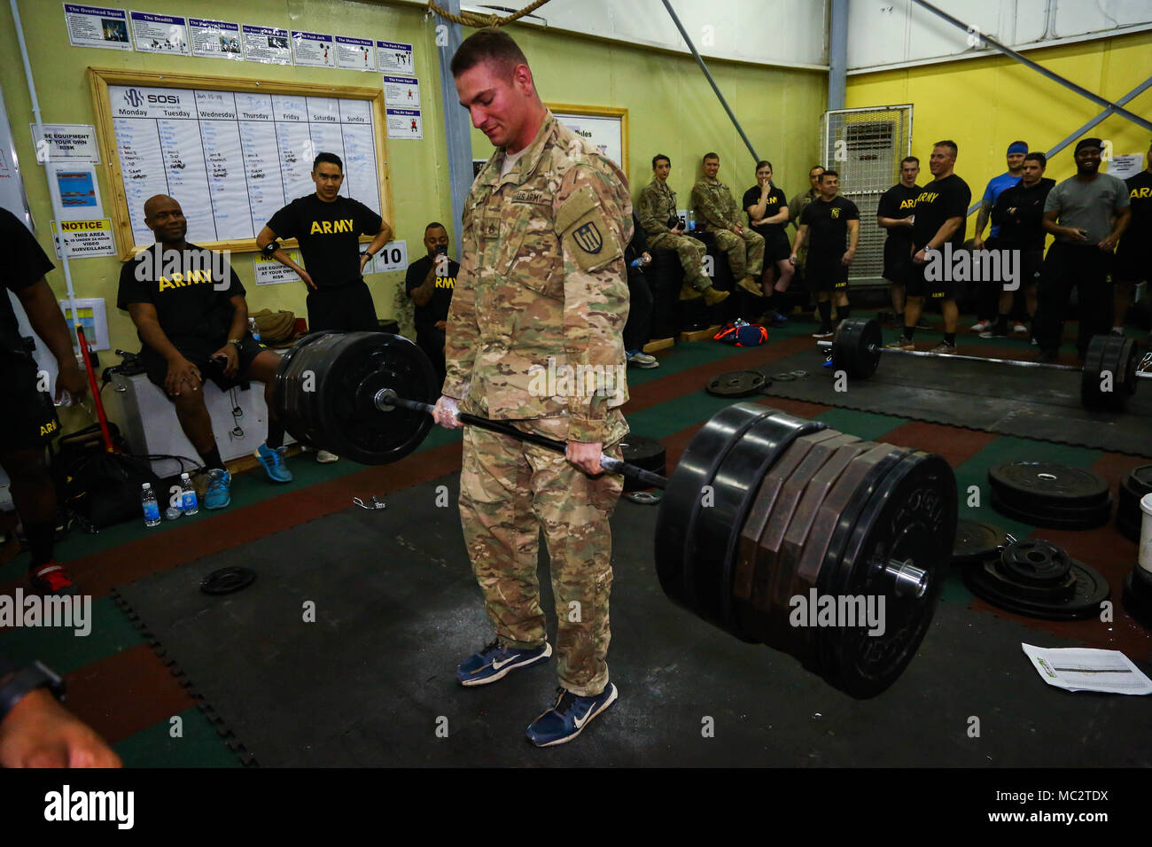U.S Army SSgt. Jaime Ross performs a deadlift with a combined weight of ...