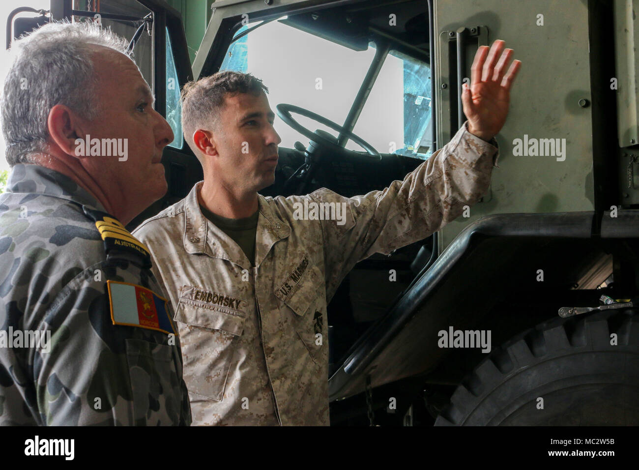 Australian Royal Navy Cmdr. Tony Case, left, the officer in charge of ...