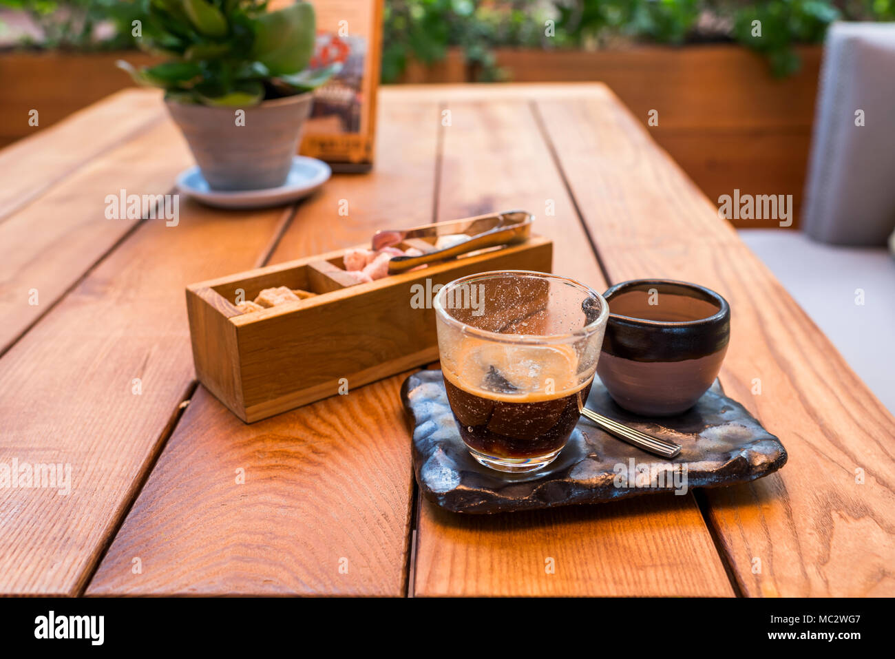 serving coffee in a cafe Stock Photo - Alamy