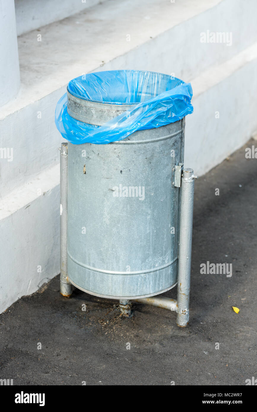 street metal trash with a package Stock Photo - Alamy