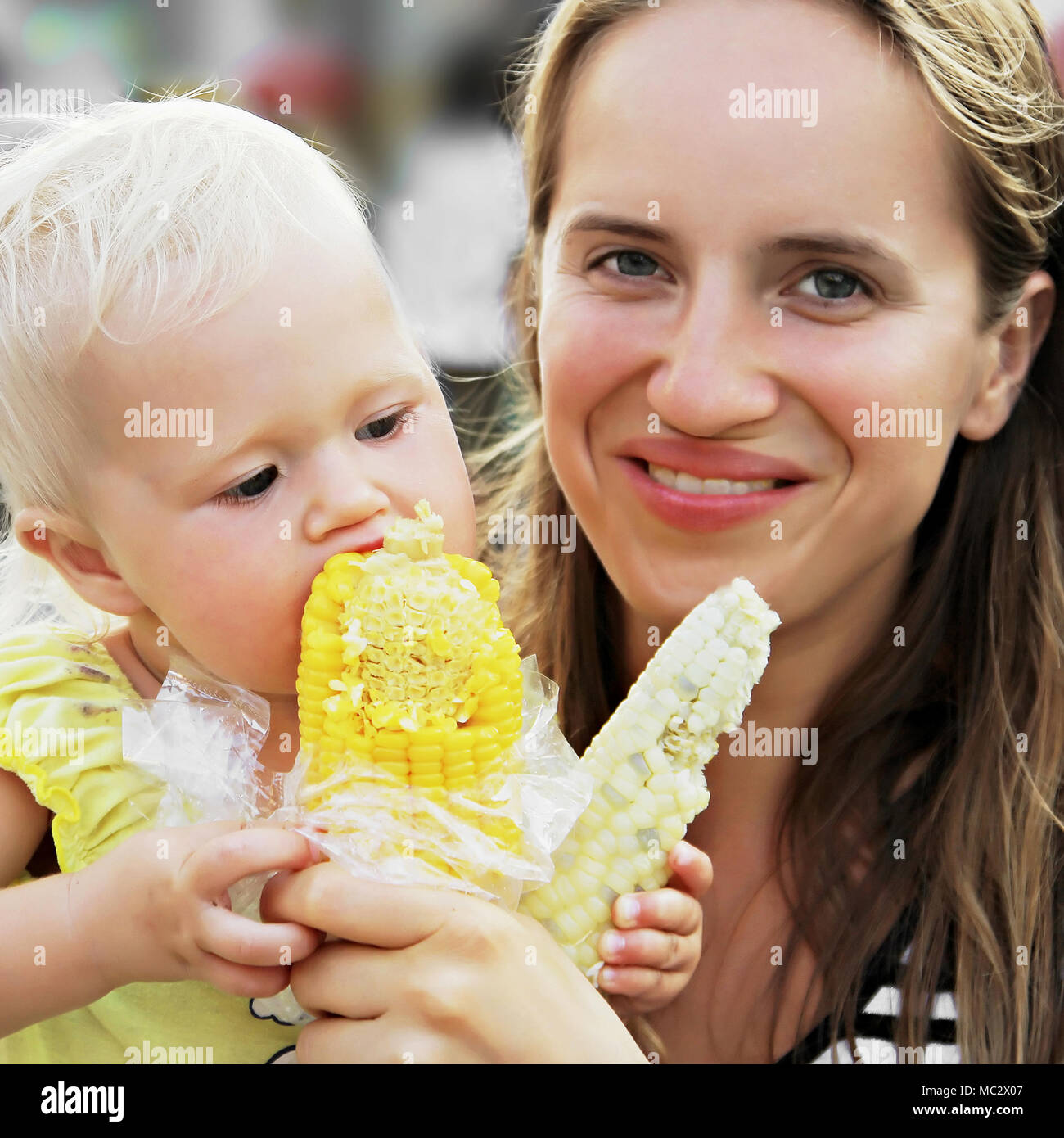 Woman child eating corn cob hi-res stock photography and images - Alamy
