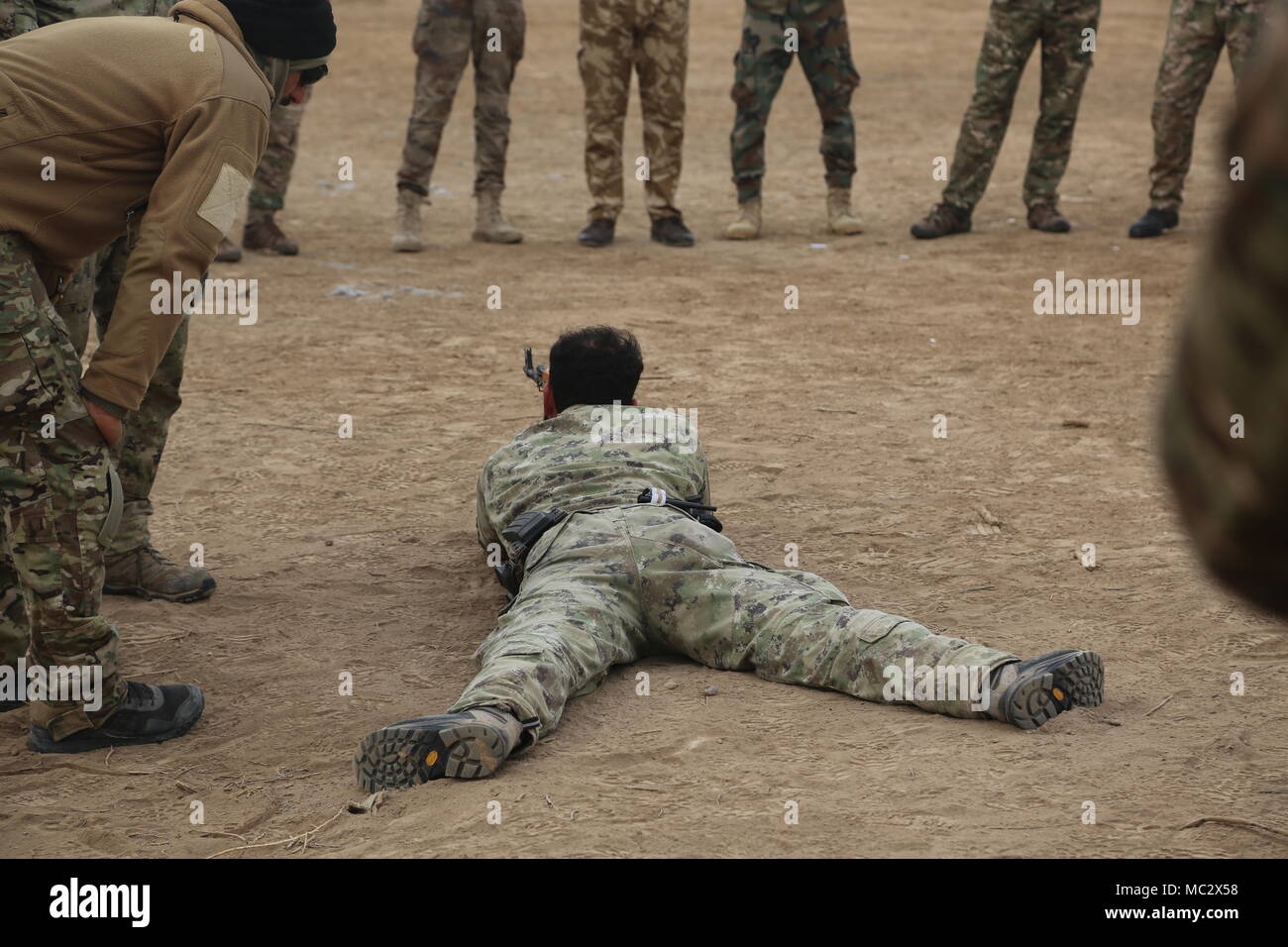 An Italian coalition member shows Iraqi soldier’s the correct form of ...