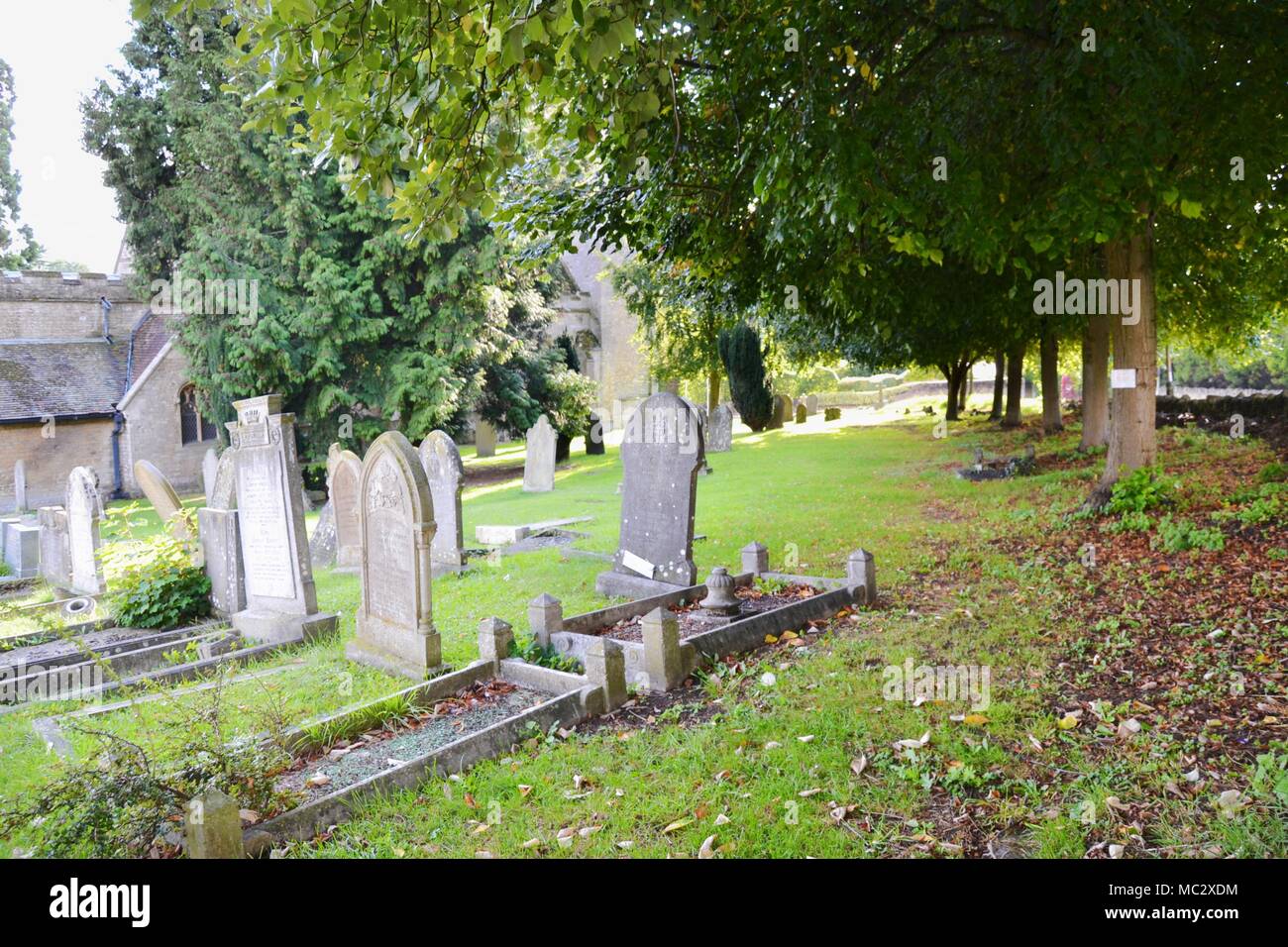 Graveyard at the Church of Saint Laurence in Stanwick, Northamptonshire ...