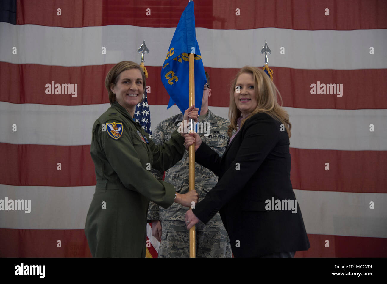 Col. Jennifer Short, 23d Wing commander, hands Paige Dukes, incoming ...