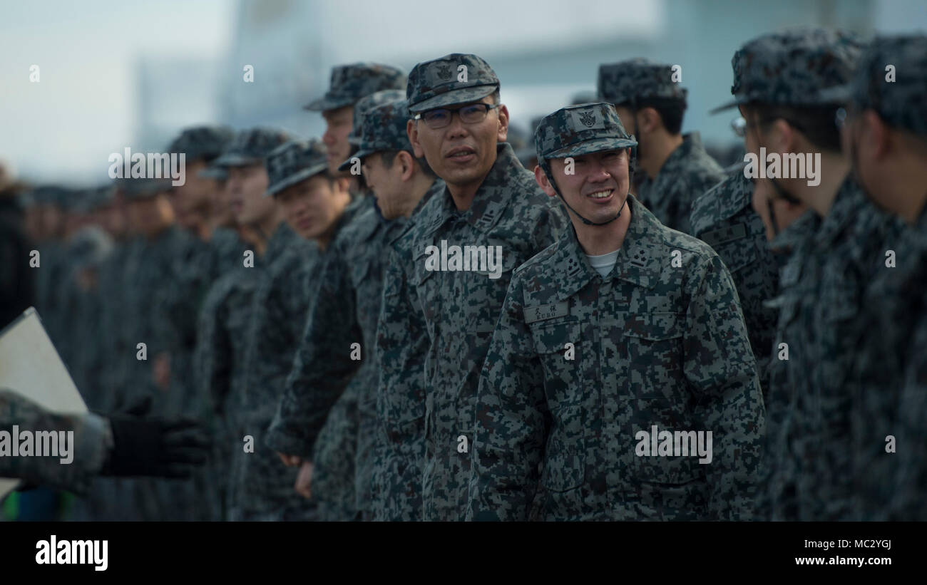 Japan Air Self-Defense Force members line up prior to the first ...