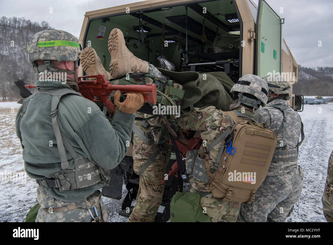 U.S. Army Soldiers with the West Virginia Army National Guard load a ...