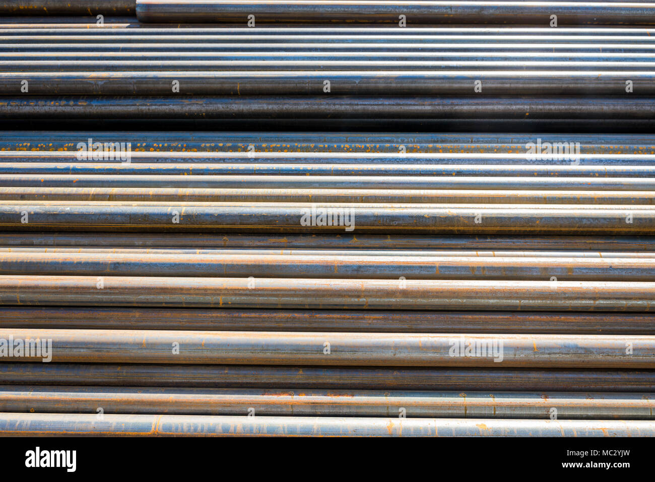 round metal-rolling pipes Stock Photo - Alamy