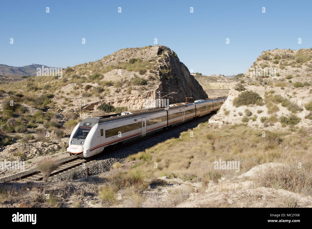 Renfe passenger train in the countryside of Spain Stock Photo - Alamy