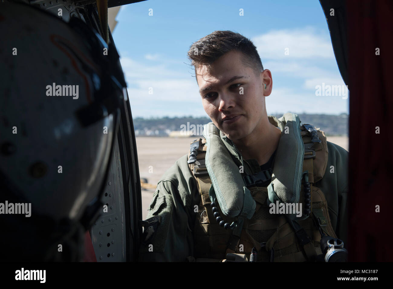 Naval Aircrewman Helicopter 2nd class Alec Serna, assigned to the ...