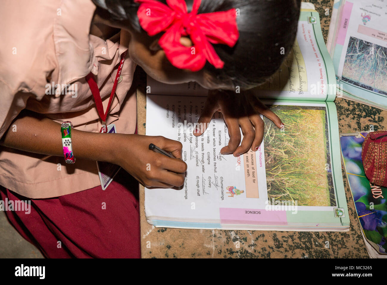 School children in classroom, with books and papers Stock Photo - Alamy