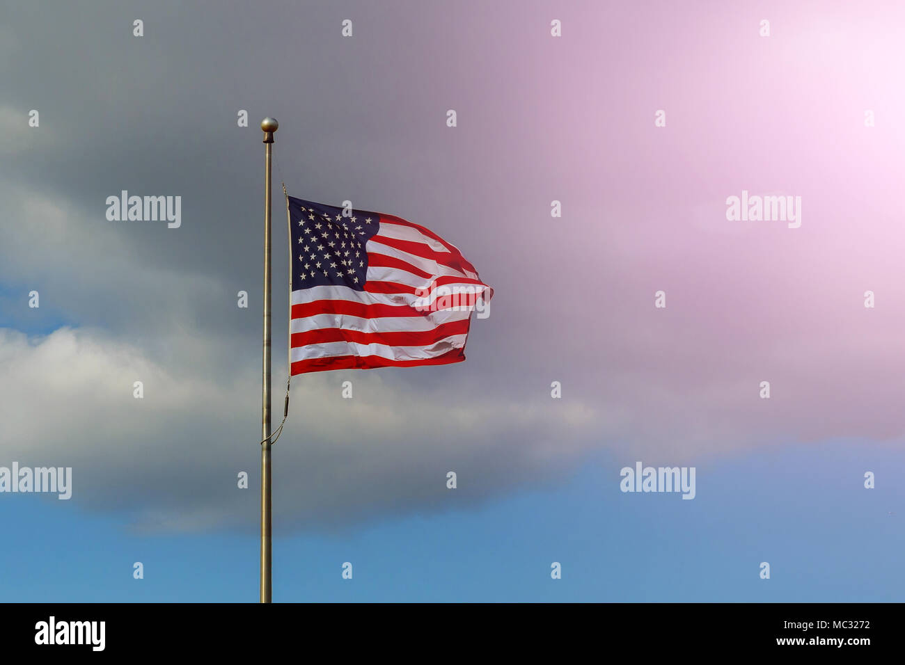 American flag hanging on pole hi-res stock photography and images - Alamy