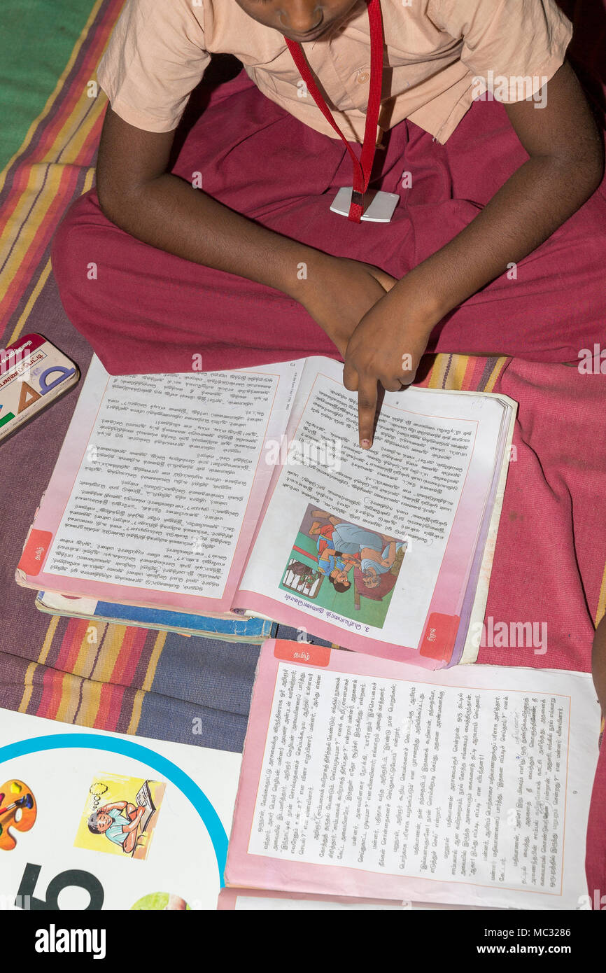 Elementary school girl reading papers hi-res stock photography and ...