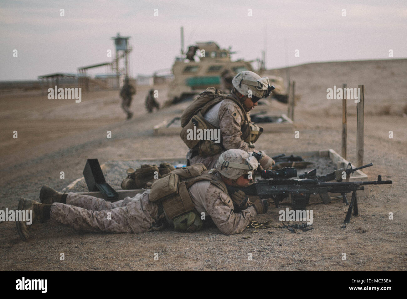 A U.S. Marine with Task Force Southwest fires the M-249G as part of the ...