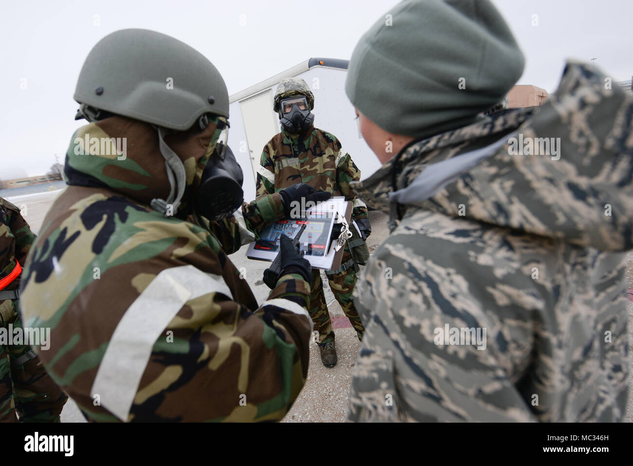 Members of the 55th Wing begin a post attack reconnaissance sweep of ...