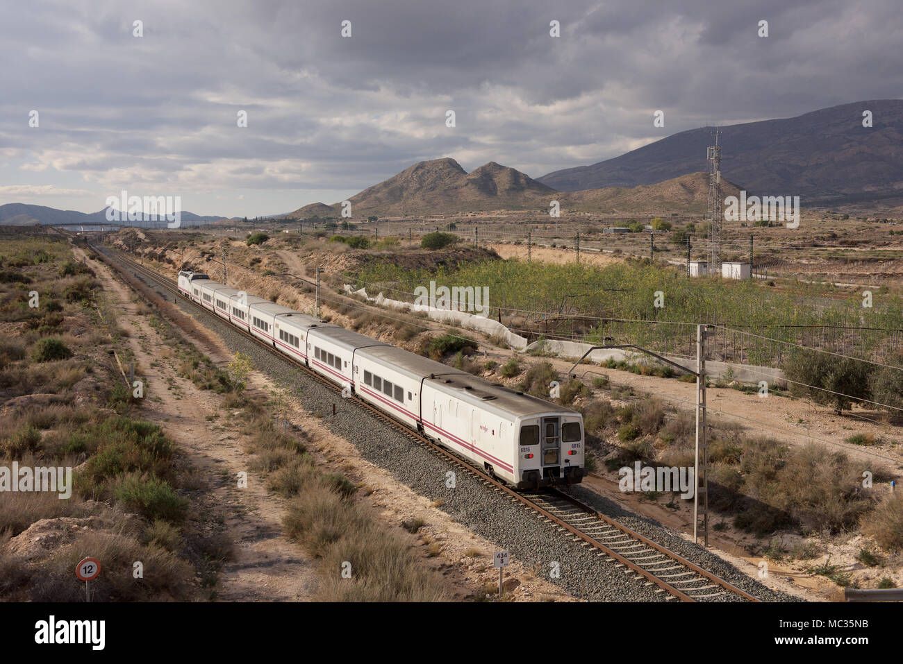 Renfe passenger train in the countryside of Spain Stock Photo - Alamy
