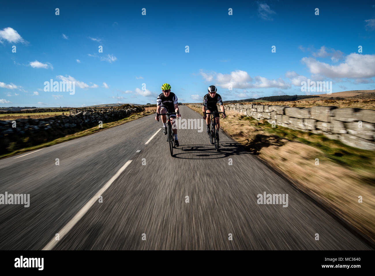 Two cyclists pedal along remote hi-res stock photography and images - Alamy