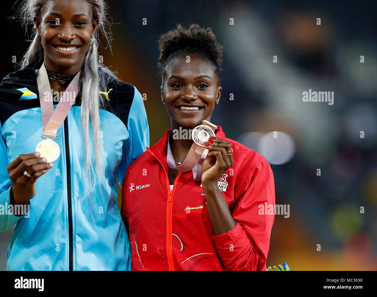 Bahamas' Shaunae Miller-Uibo (left) and England's Dina Asher-Smith ...