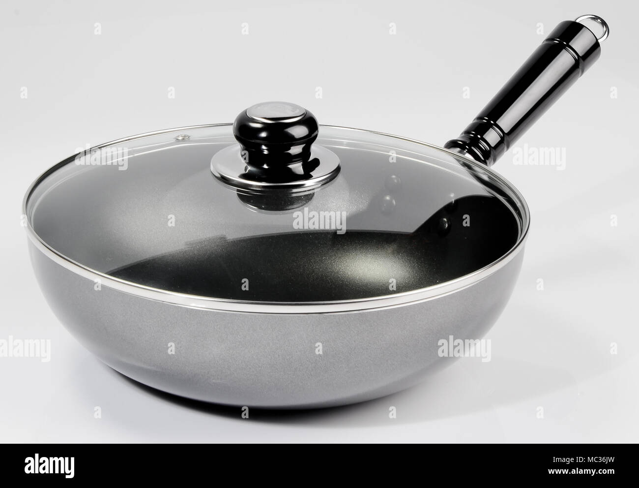 Pan with handle on white background Stock Photo - Alamy