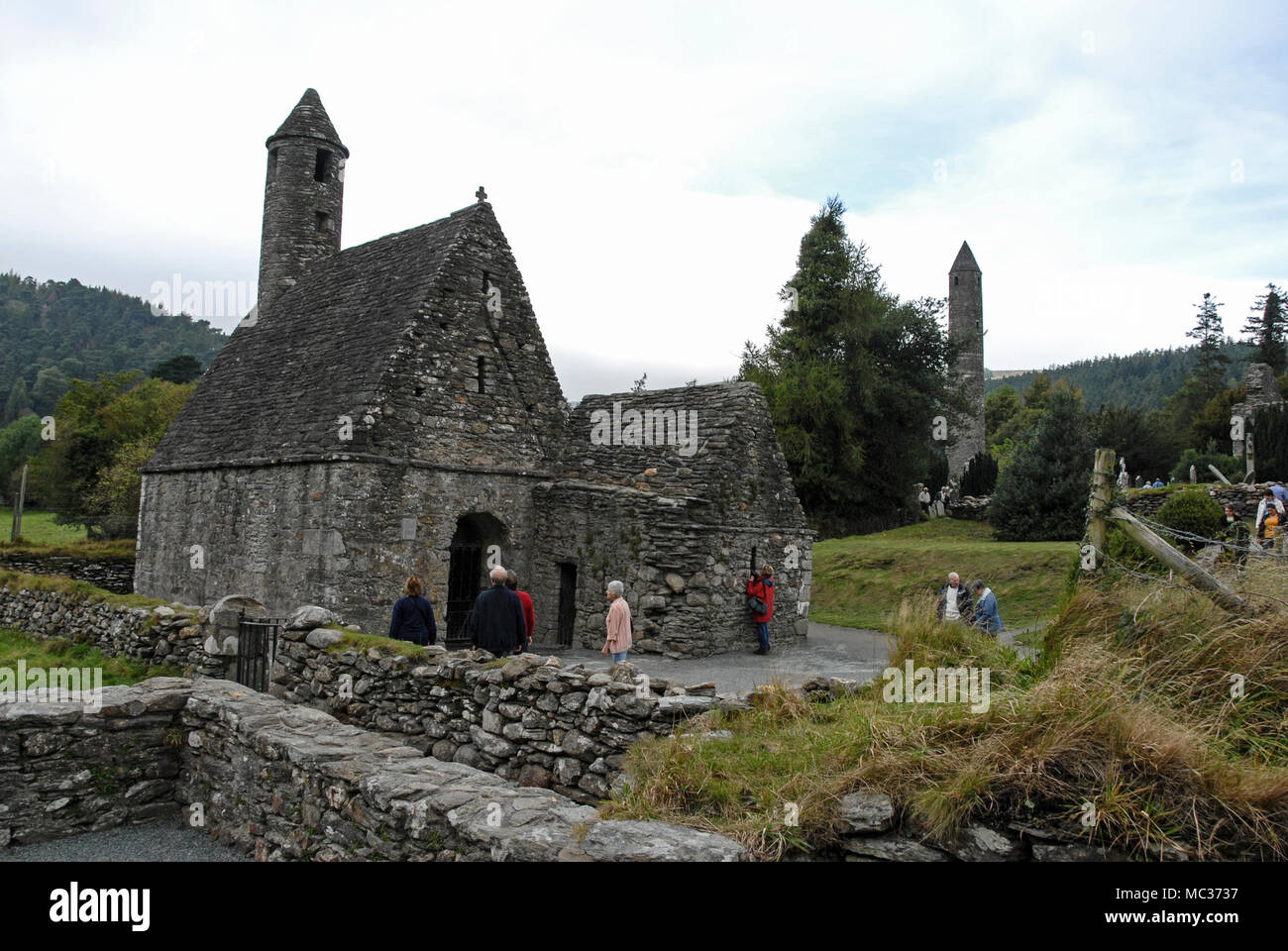 St. Kevin's Church and the 30 meters high Round Tower at Glendalough in ...