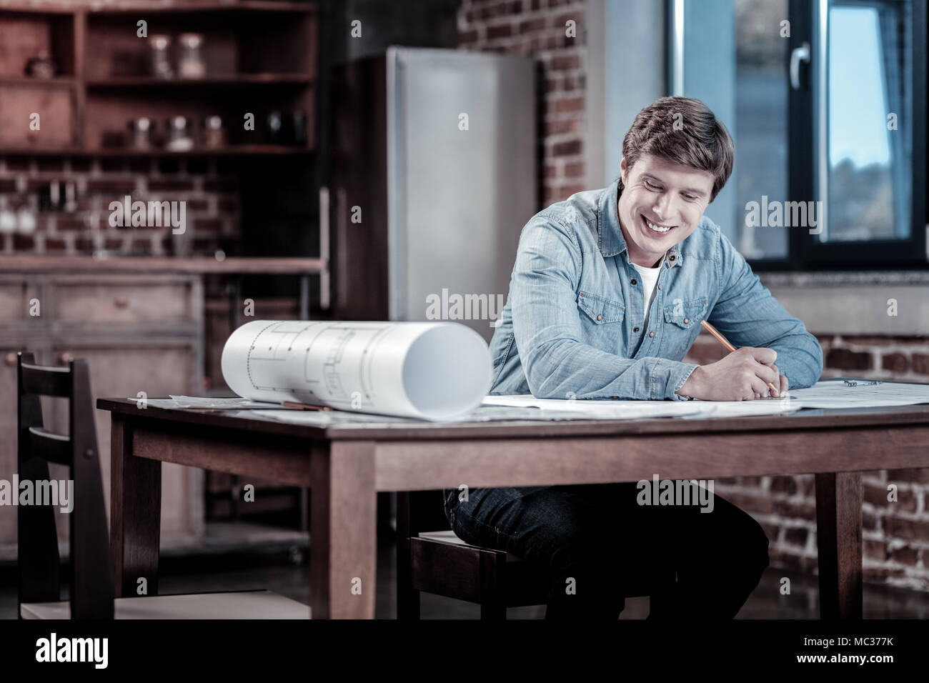Attractive male engineer drawing line Stock Photo - Alamy