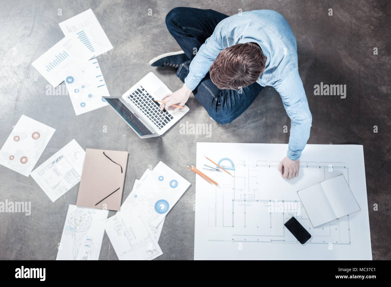 Ambitious male engineer gathering all data Stock Photo - Alamy