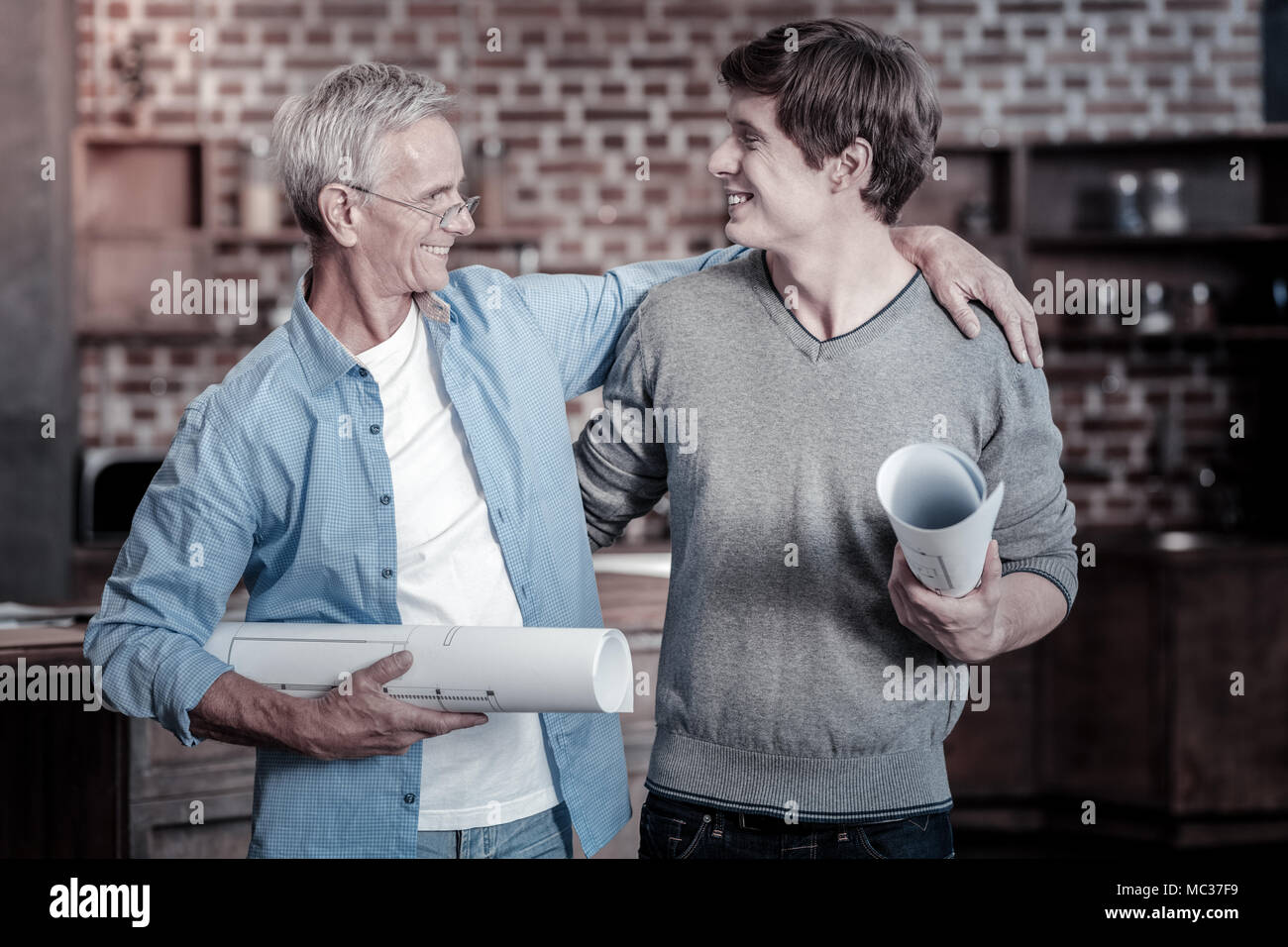Cheerful male engineers celebrating accomplishment Stock Photo - Alamy