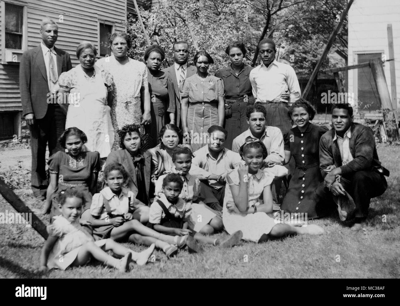 A multigenerational African American family pose for a photograph in ...